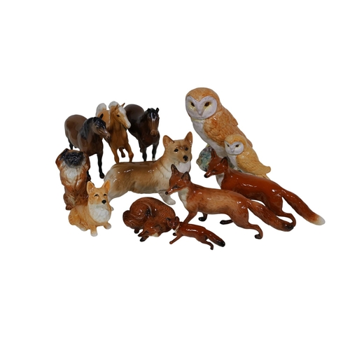 A collection of Beswick ware, Barn Owls, Foxes, Horses and Dogs ...