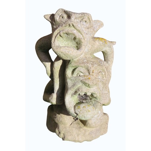 A group of five weathered cast composition stone gargoyle ornaments ...