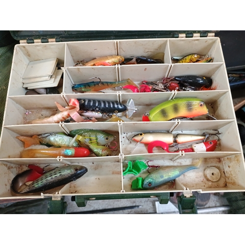 Assortment of fishing lures in Excalibur box