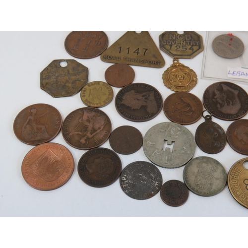 Box full of old coins, tokens and pit checks
