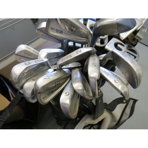 Three bags of assorted golf clubs including Nike, Ping, Odyssey etc
