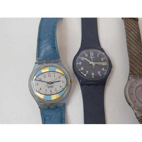 Five vintage Swatch watches.