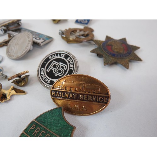 A good collection of vintage and antique pin badges.