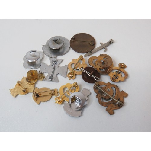 Fifteen assorted pin badges including military