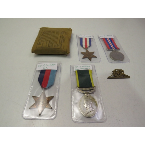 WWII 1939 field dressing, badge, and medal awarded to Sergeant Wardale ...