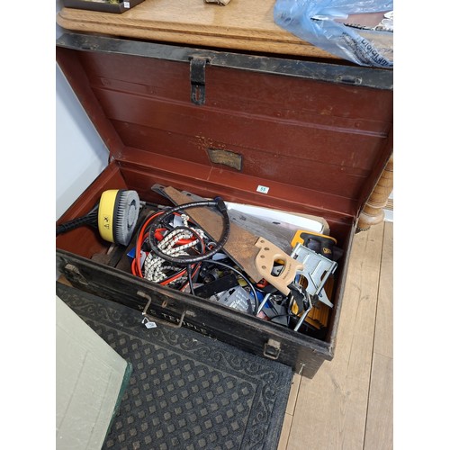 Large metal trunk with various tools and equipment