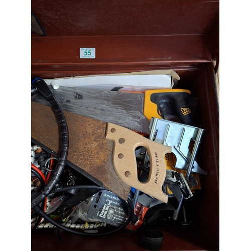Large metal trunk with various tools and equipment