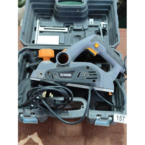 A cased titan electric planer complete with accessories and dust bag ...