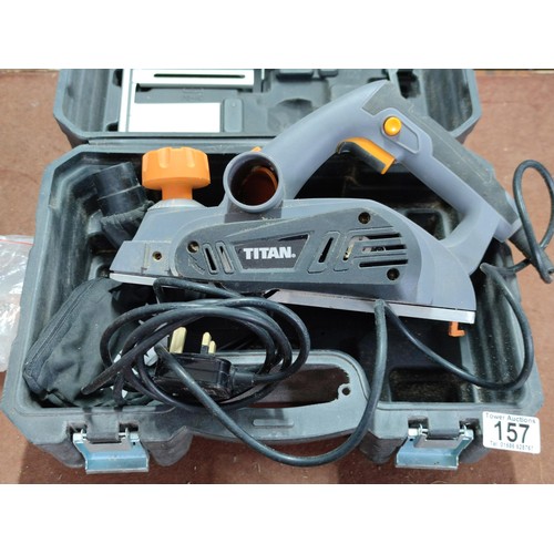 A cased titan electric planer complete with accessories and dust bag ...