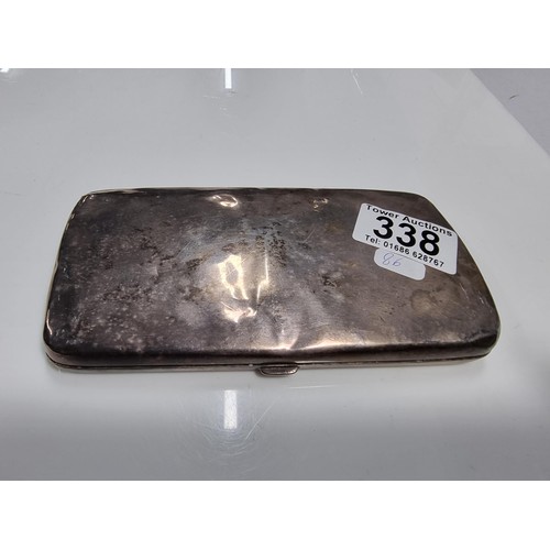 A large hallmark silver double cigarette case with a curved back shape ...