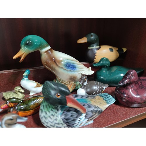 A collection of 22 wooden, ceramic and stone ducks, many are hand ...