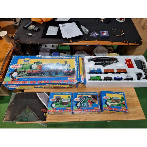 A boxed Hornby R9054 Thomas and Percy train set along with 3 boxed ...