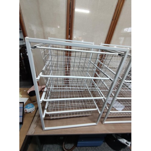 2x white metal storage racks, each rack has 4 basket shelves in good ...