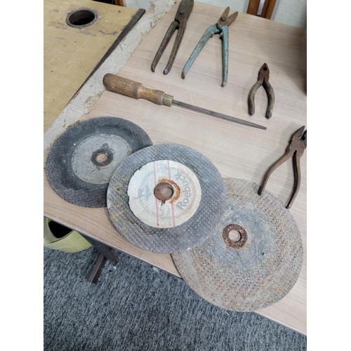 Crate containing a quantity of grinding disks, pliers, spanners, metal ...