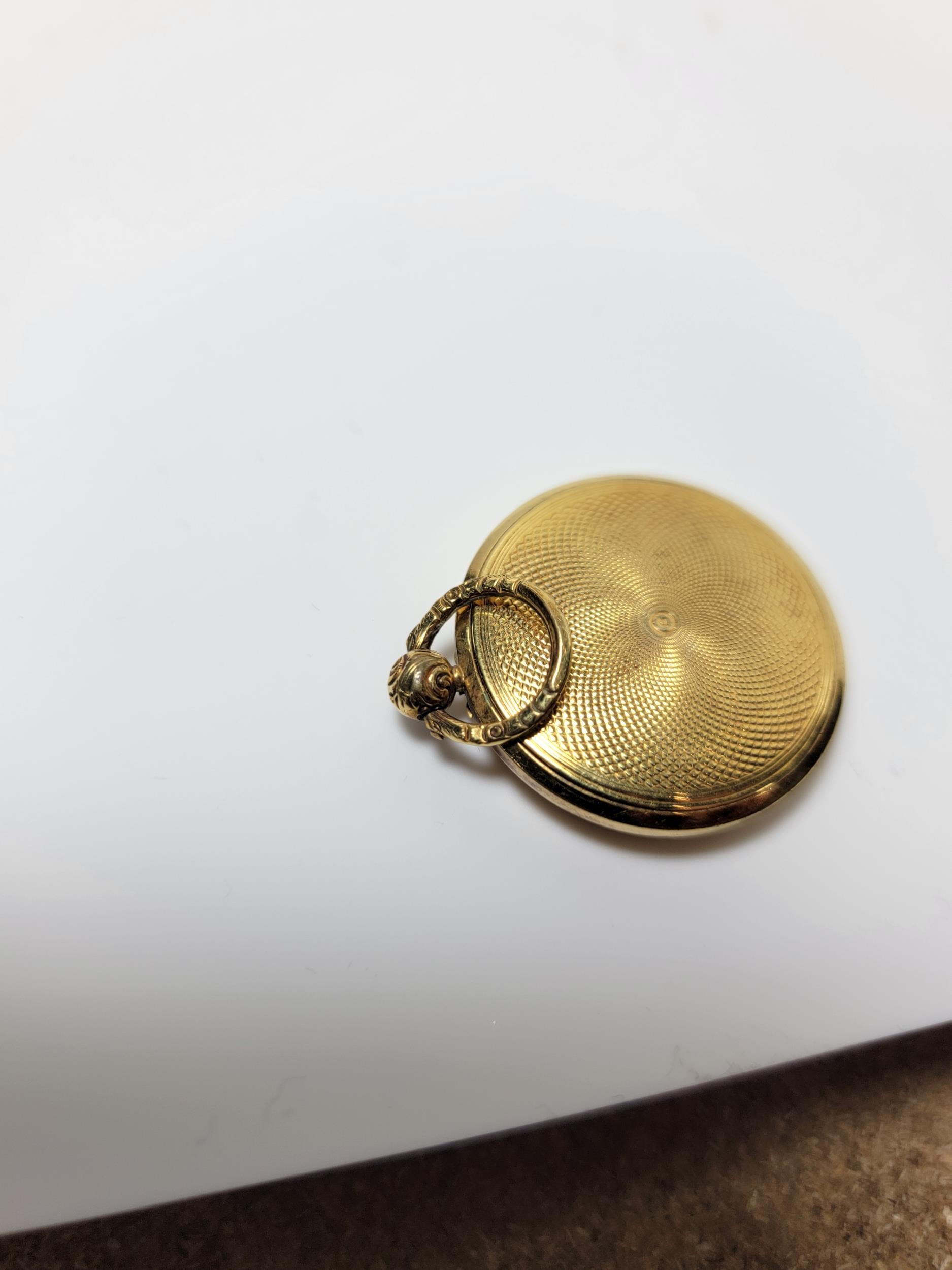 Good quality 9ct gold tested locket with intricate machine turned ...