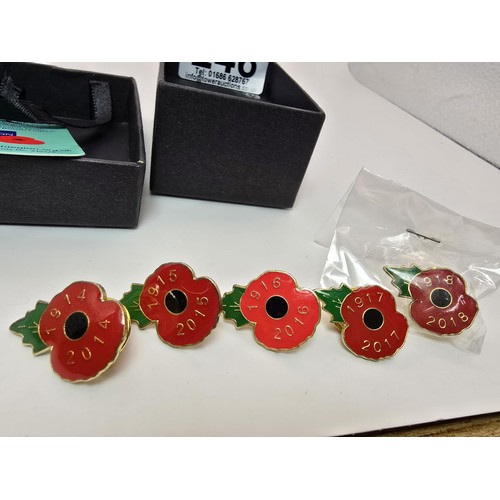 A quantity of Royal British Legion poppy pin badges, 5 in total with ...