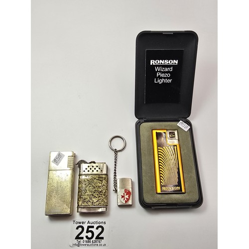 A quantity of 4 vintage collectable lighters to include an attractive ...