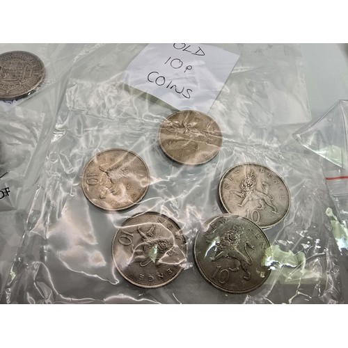 A selection of various vintage British coins all which are organized ...