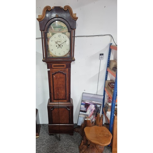 An antique long case grandfather clock in mahogany with inlay to the ...