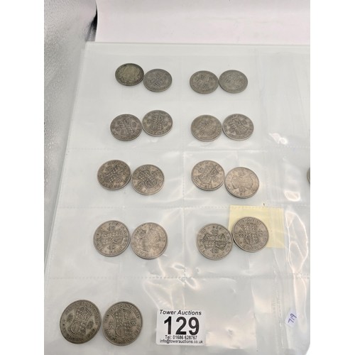 A collection of 31 half crown British coins which includes 7 silver ...
