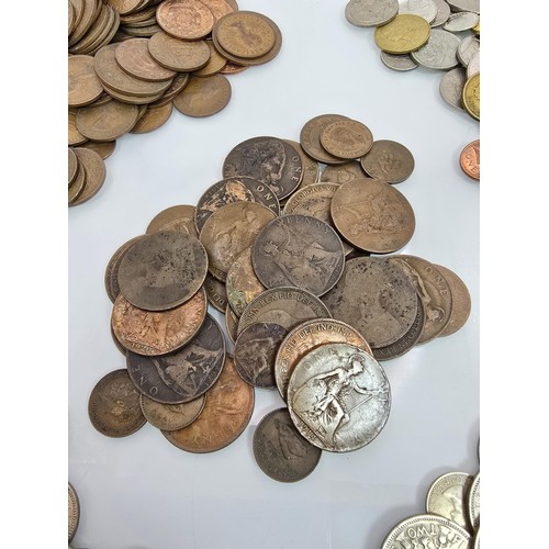 A large quantity of vintage British coins to include 2 large bags of ...