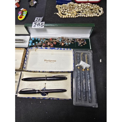 A collection of various collectable cased pen sets along with a cased ...