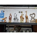 A collection of resin and wooden Giraffe figures to include a grey ...