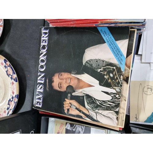 A large collection of Elvis related items to include 35 Elvis records ...