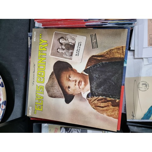A large collection of Elvis related items to include 35 Elvis records ...