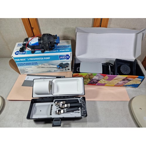 A boxed Par Max 3 fresh water pump by Jabsco along with a boxed grater ...