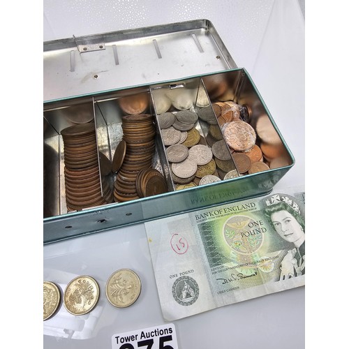 A good vintage metal coin saving tin containing a large quantity of ...