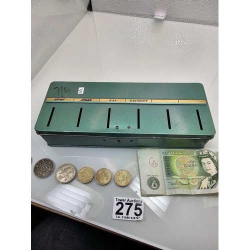 A good vintage metal coin saving tin containing a large quantity of ...