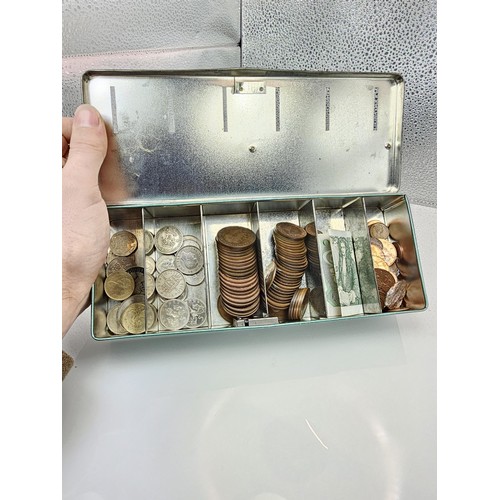 A good vintage metal coin saving tin containing a large quantity of ...