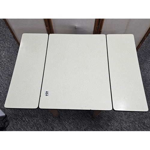 A 1960's formica topped small drop leaf kitchen table in a mottled ...