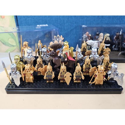 A collection of Mirkwood Elves figures in 4 perspex boxes covering ...