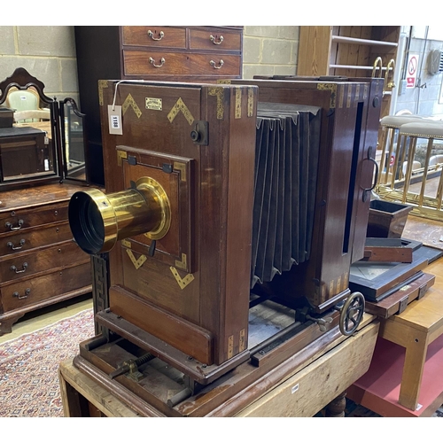 An early 20th century Hunter-Penrose Ltd. brass mounted mahogany studio ...