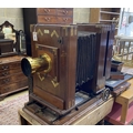 An early 20th century Hunter-Penrose Ltd. brass mounted mahogany studio ...