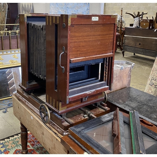 An early 20th century Hunter-Penrose Ltd. brass mounted mahogany studio ...