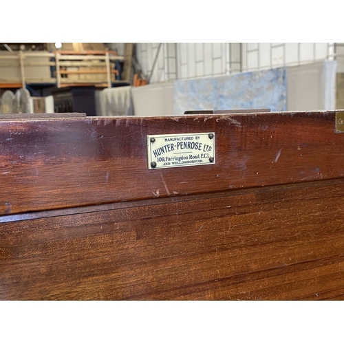 An early 20th century Hunter-Penrose Ltd. brass mounted mahogany studio ...