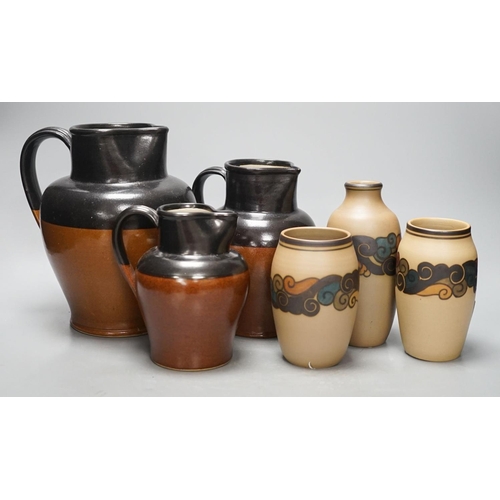 A graduated set of three Bourne Denby stoneware jugs and three 1930's ...