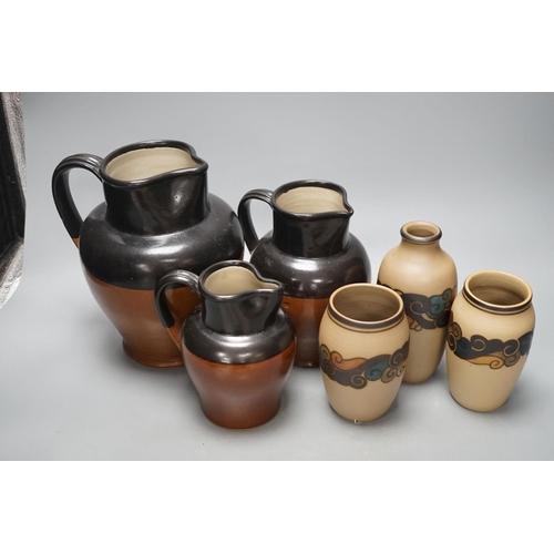 A graduated set of three Bourne Denby stoneware jugs and three 1930's ...