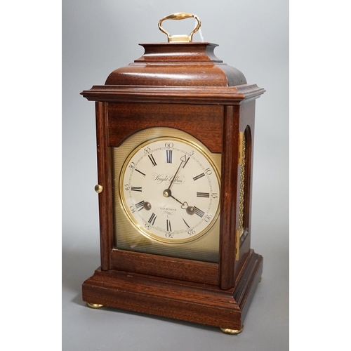 Knight and Gibbins. A reproduction mantel clock, 30c high