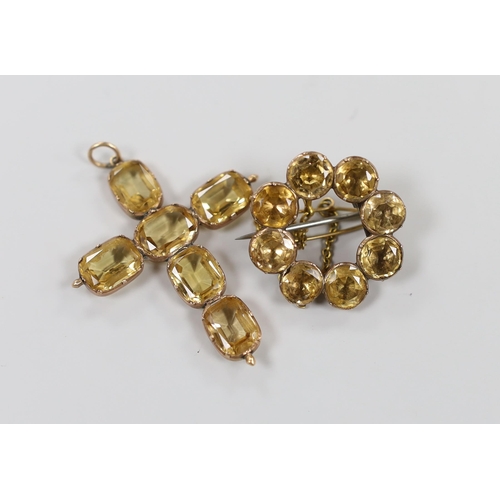 A yellow metal and six stone oval cut yellow topaz set cross pendant ...