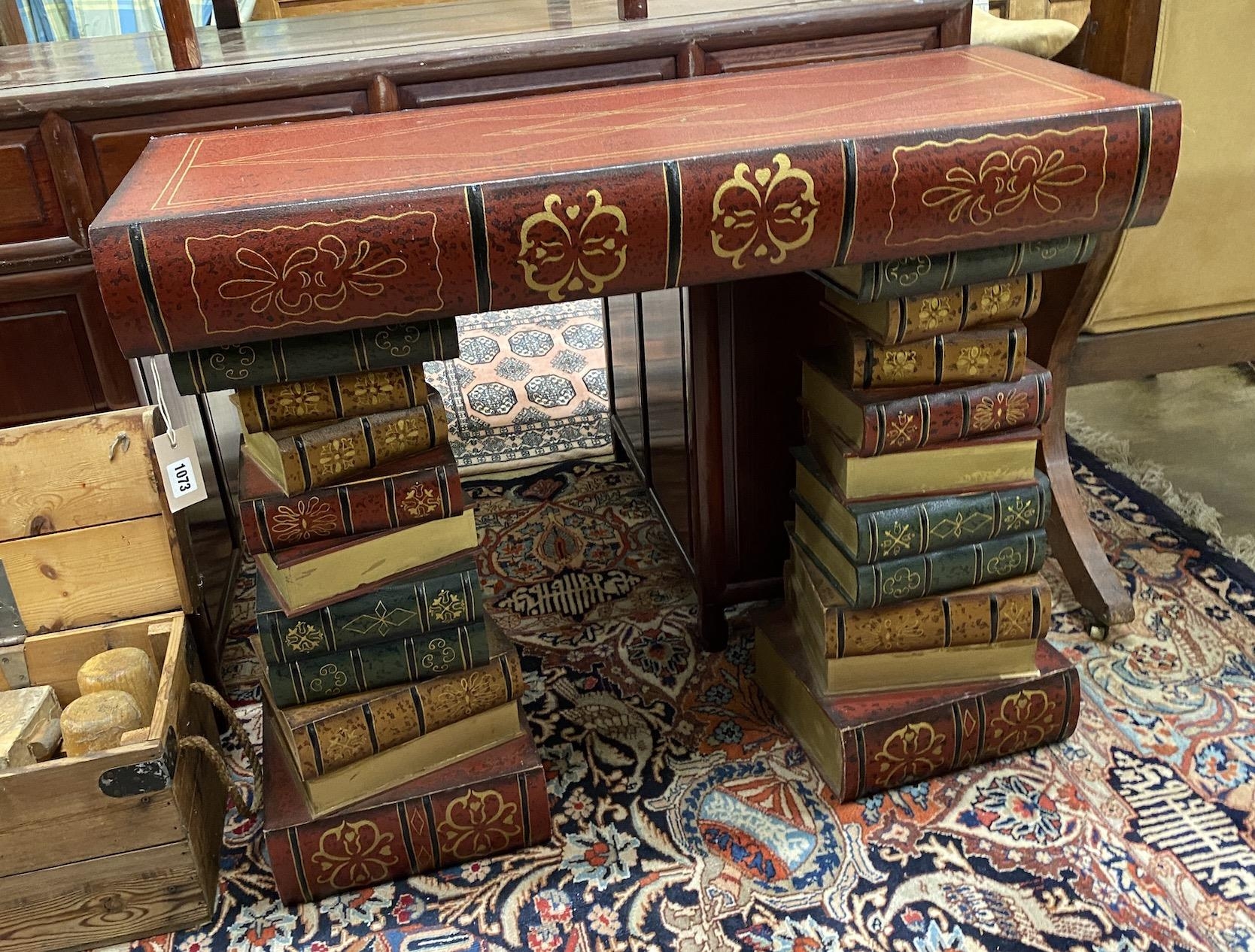 A contemporary painted console table modelled as a stack of books ...