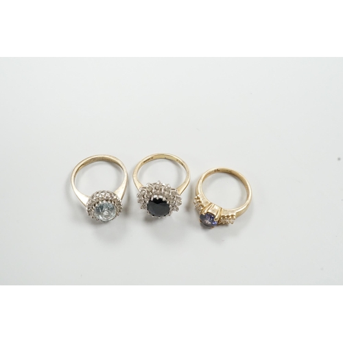Three assorted modern 9ct gold and gem set dress rings, including ...