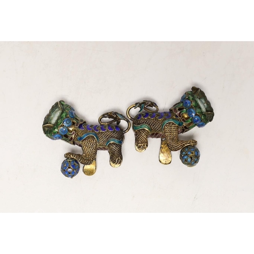 A pair of Chinese? gilt white metal and enamel Shi Shi, length 45mm.