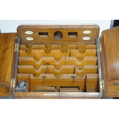 A Victorian walnut stationery box with pull out writing slope, ivory ...