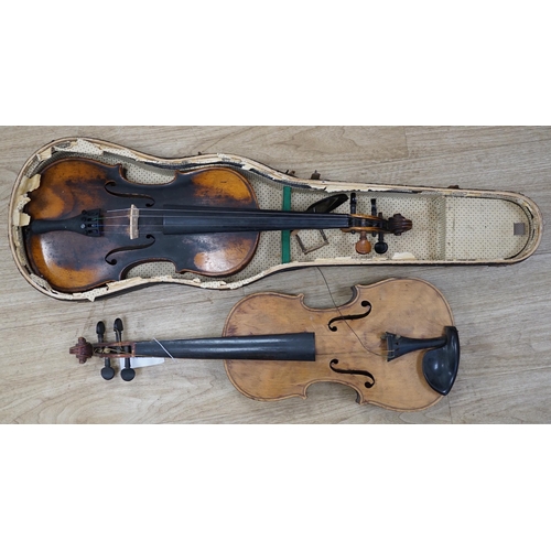 Two early 20th century violins, one in the remains of a case, both for ...