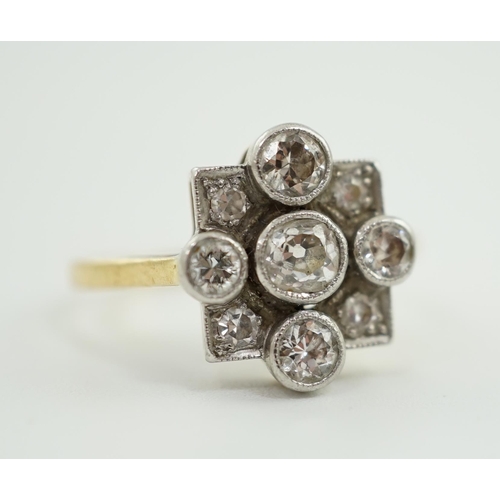 A 1920's/1930's 18ct gold, platinum and millegrain set nine stone ...