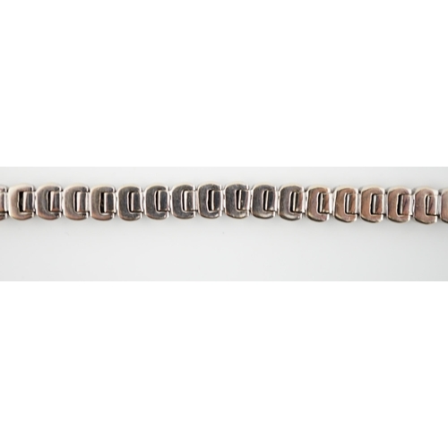 A modern 18ct white gold and collet set forty seven stone round ...